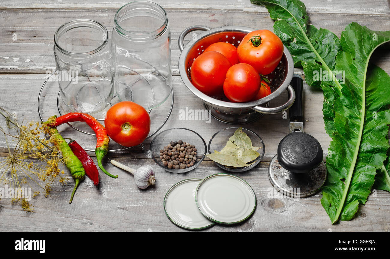 Tomato,spices and cooking utensils for pickling vegetables Stock Photo ...
