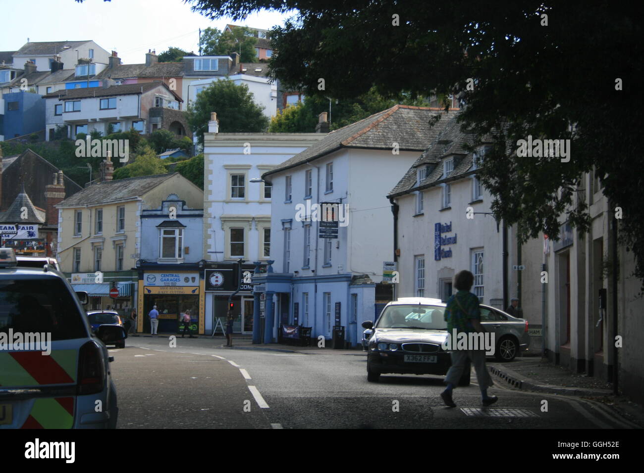 Woman running across road Stock Photo - Alamy