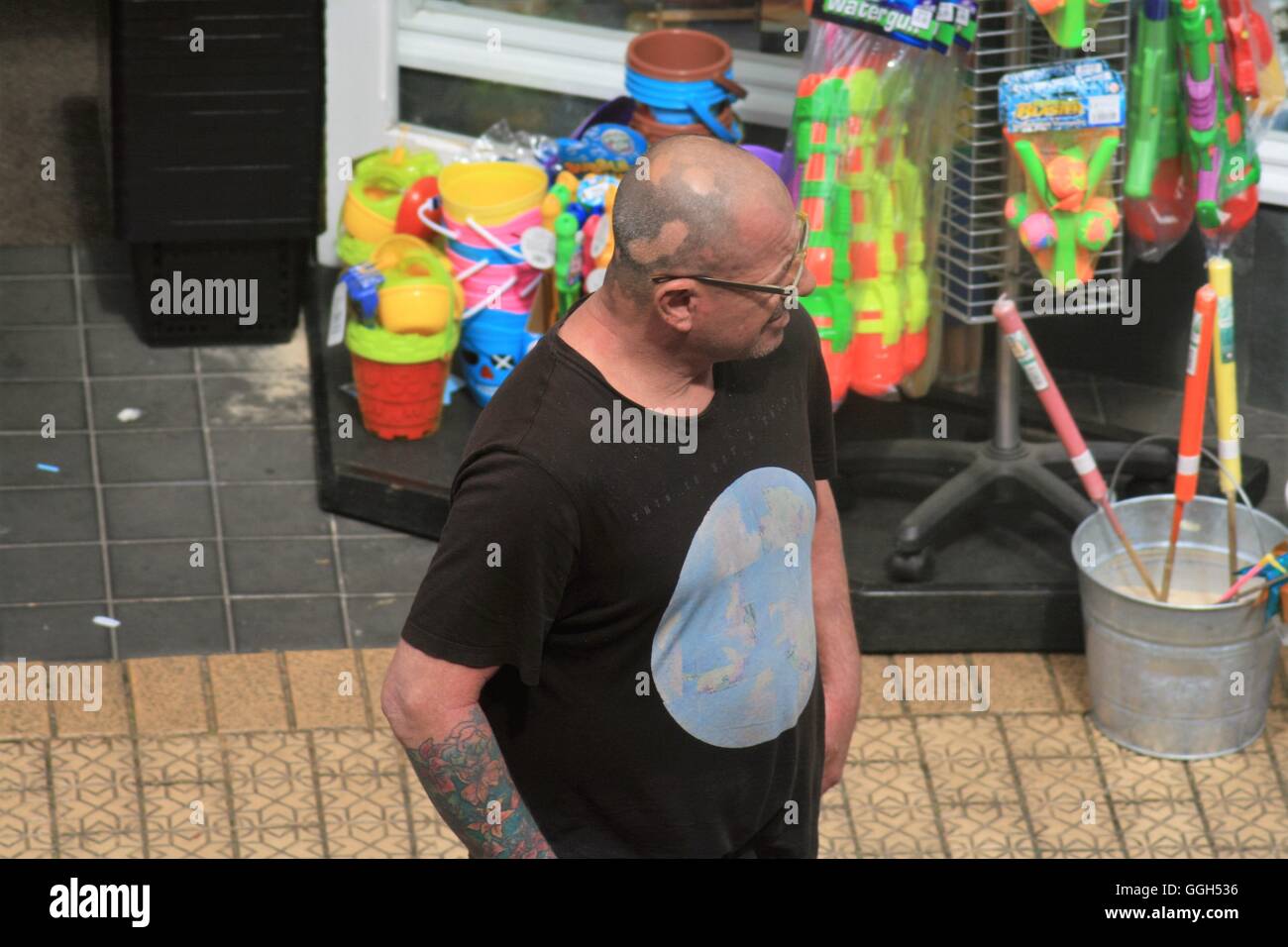 man stood outside shop, bald man, man, normal man, average man, public ...