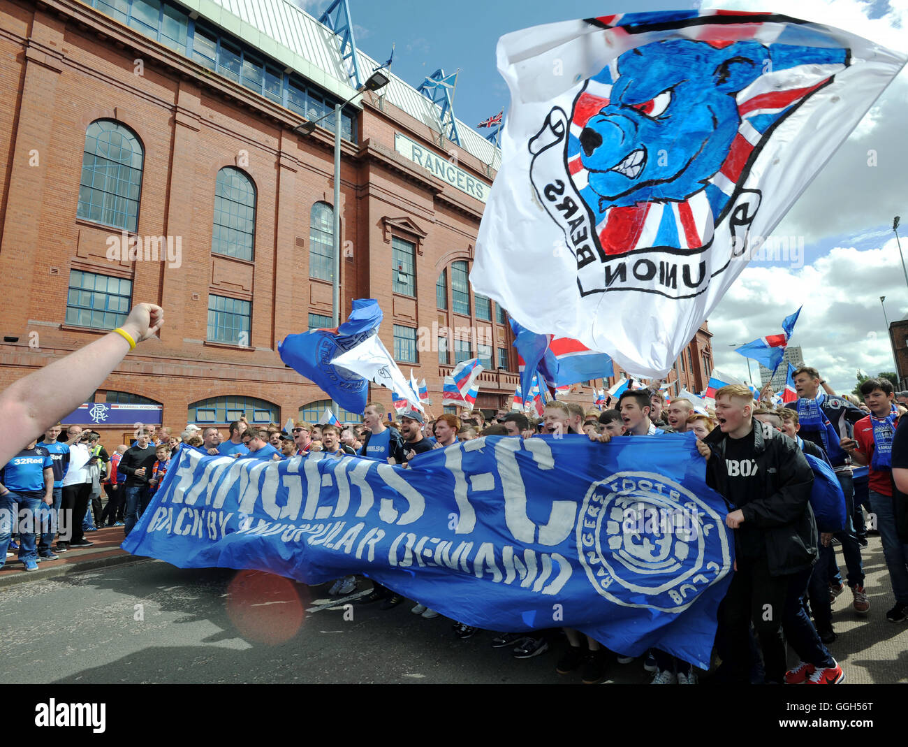 Rangers fans march to Ibrox stadium before the Ladbrokes Scottish ...