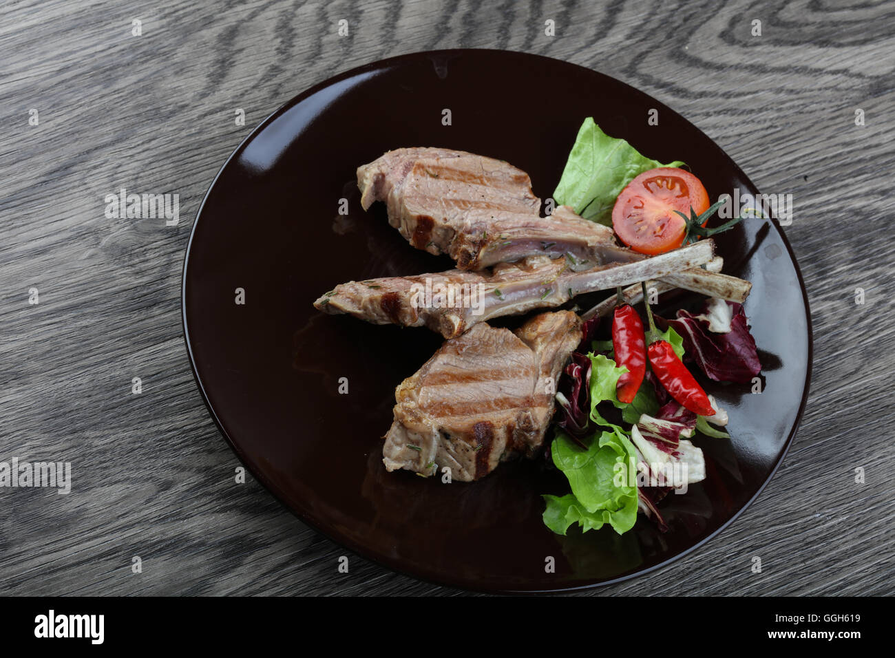 Lamb Frenched Rack grilled rib bone Stock Photo - Alamy