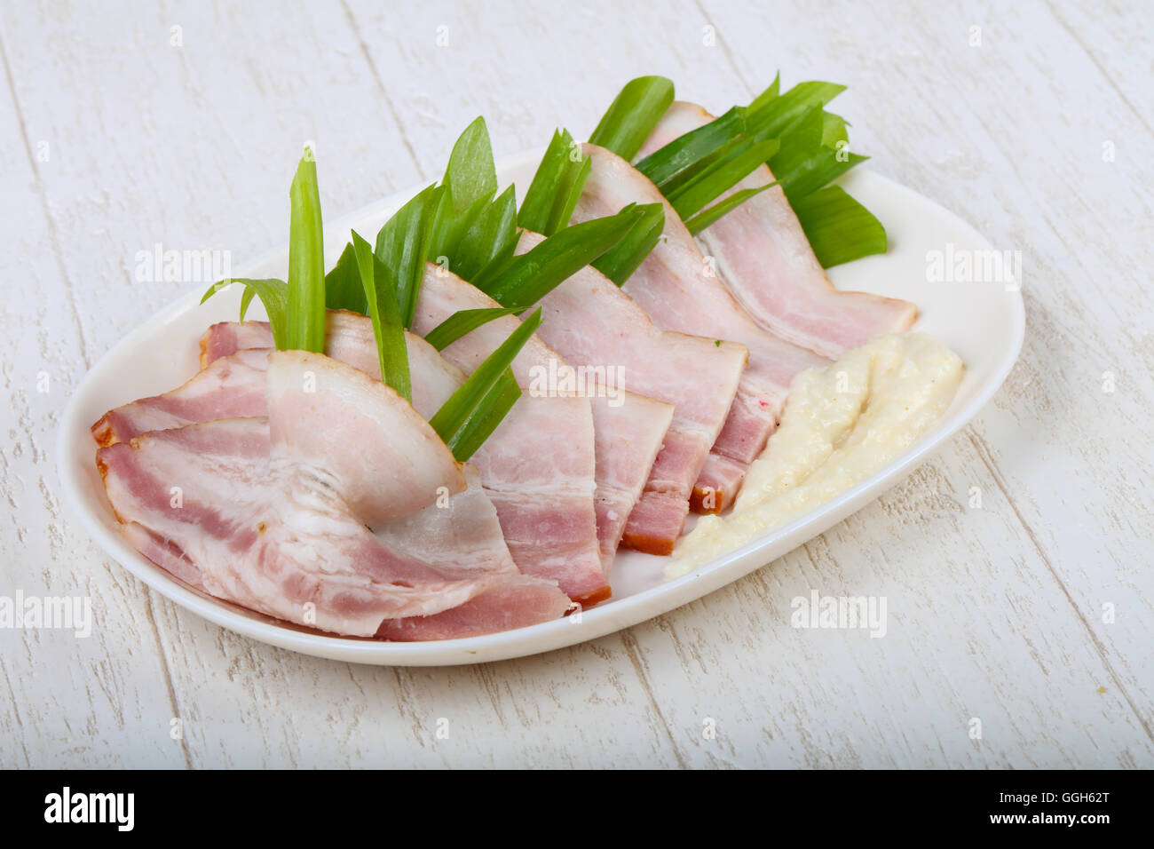 Ham with onion on the white plate Stock Photo - Alamy