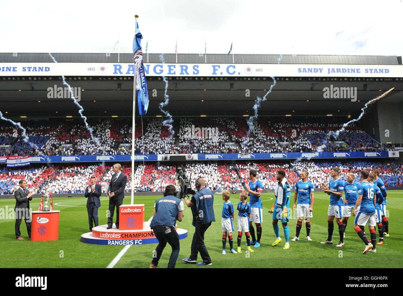 Rangers players look on as the 2015/16 Championship flag is unfurled ...