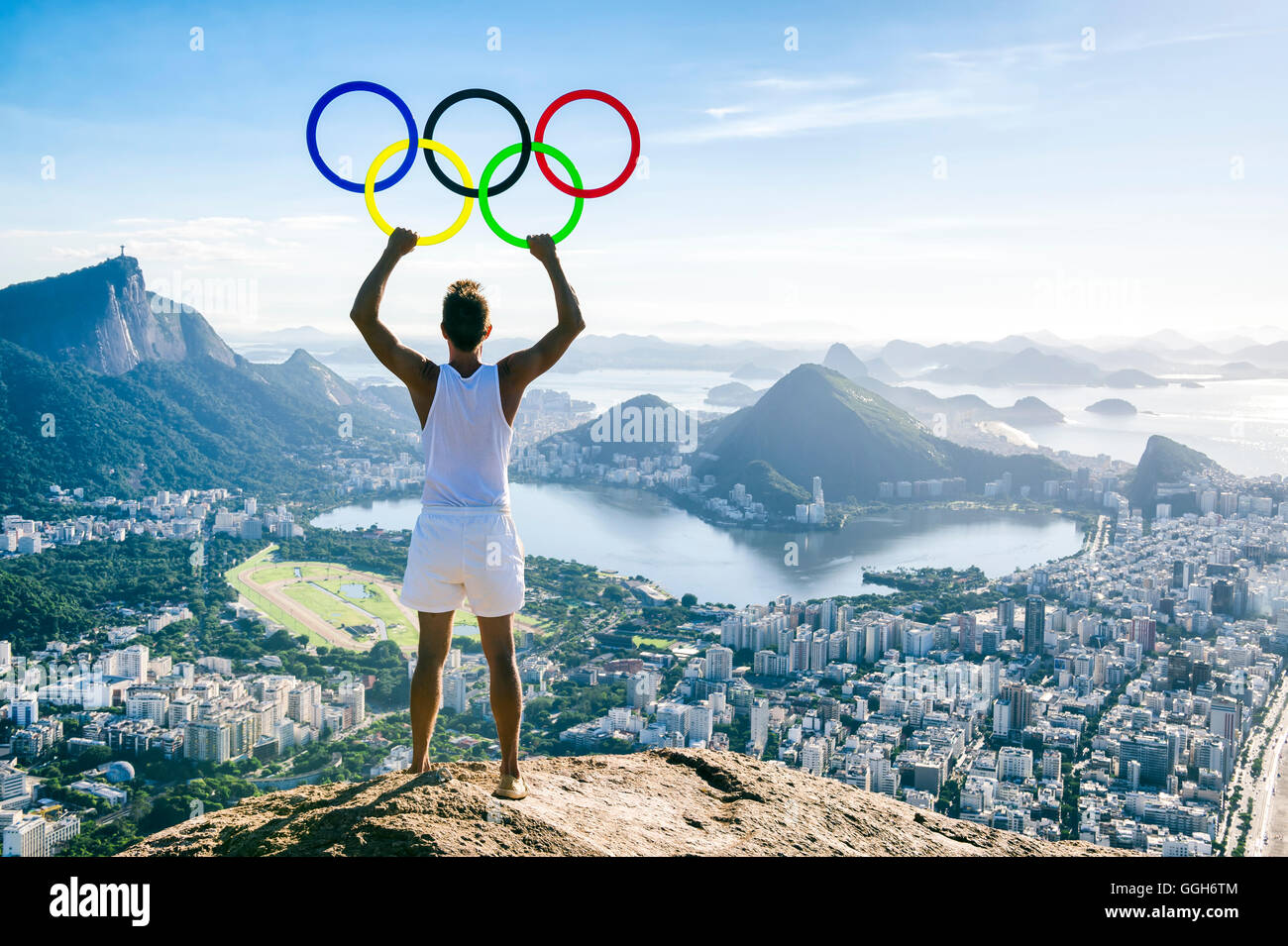 RIO DE JANEIRO - MARCH 21, 2016: An athlete holds Olympic rings under ...