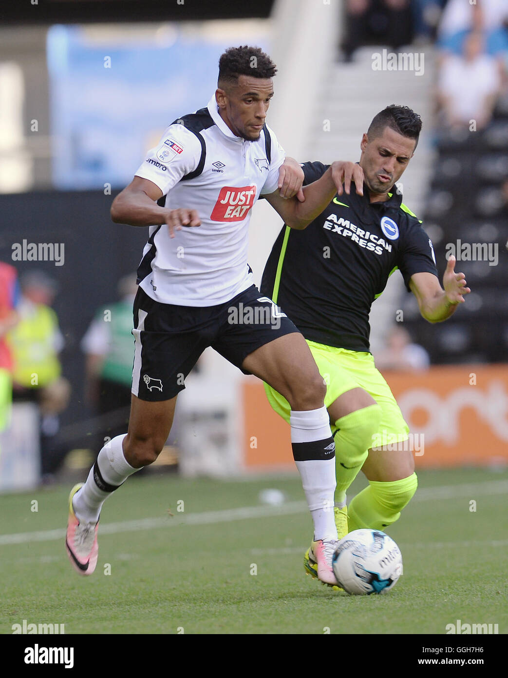 Derby County's Nick Blackman (left) and Brighton & Hove Albion's Beram ...