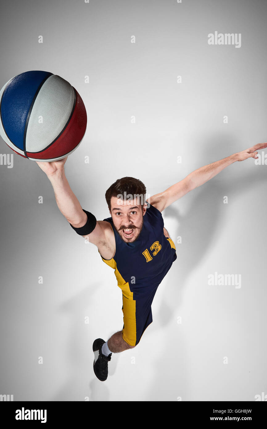 Full length portrait of a basketball player with ball Stock Photo - Alamy