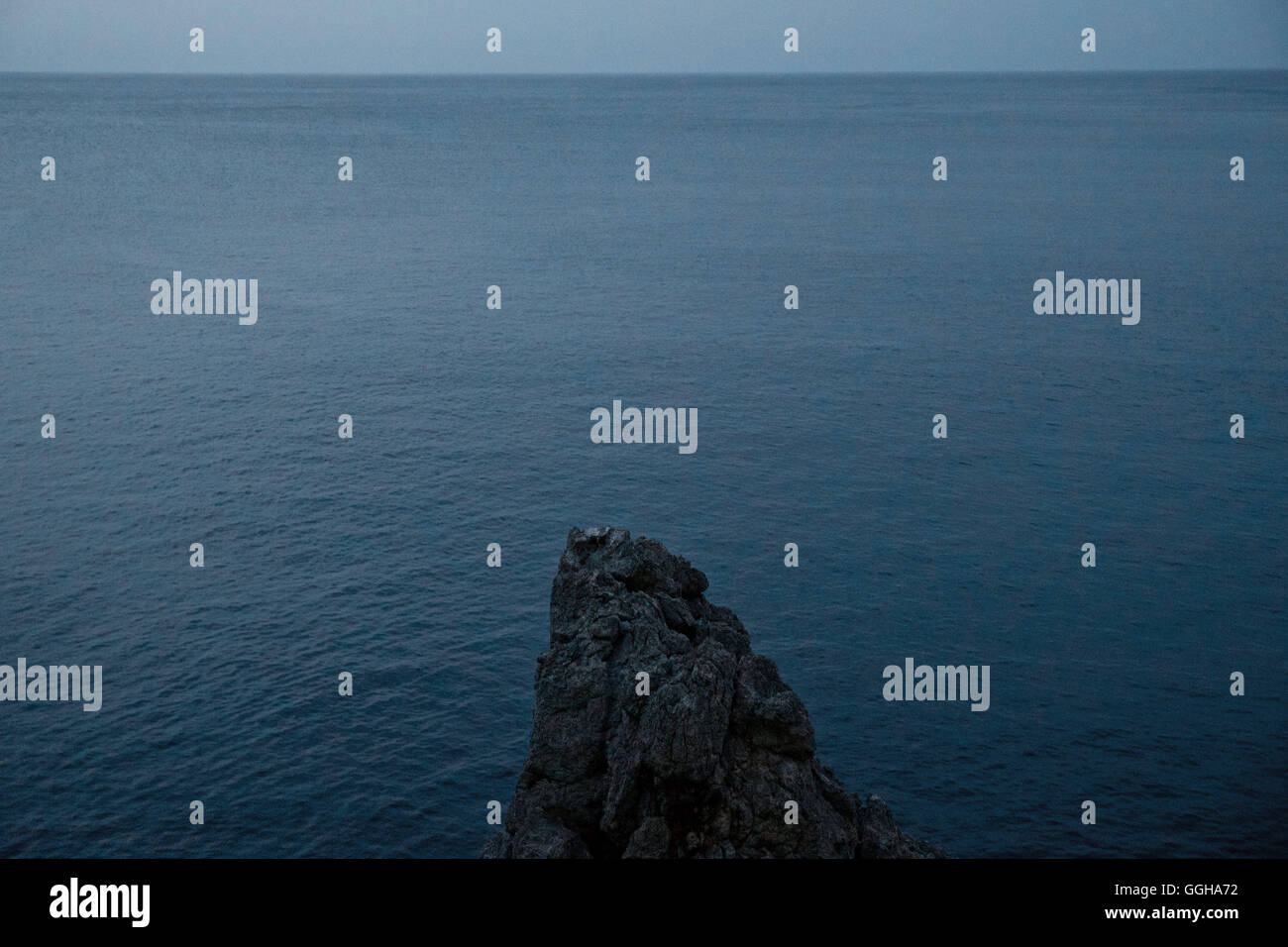 Spiky rock in the sea, Mallorca, Spain Stock Photo - Alamy