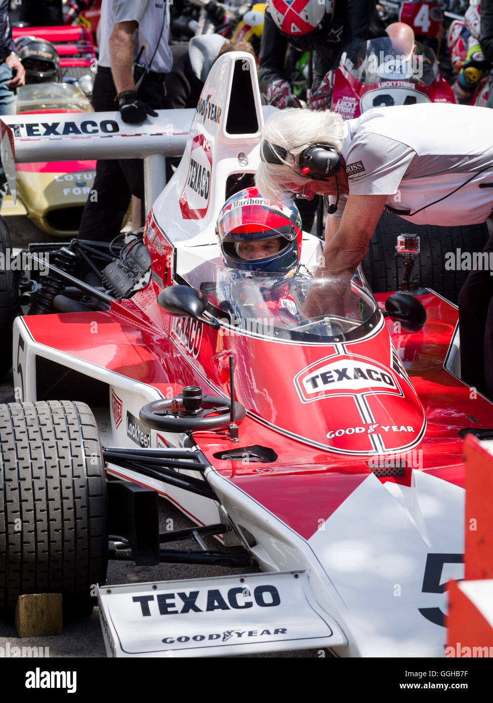Emerson fittipaldi strapped into his car hi-res stock photography and ...