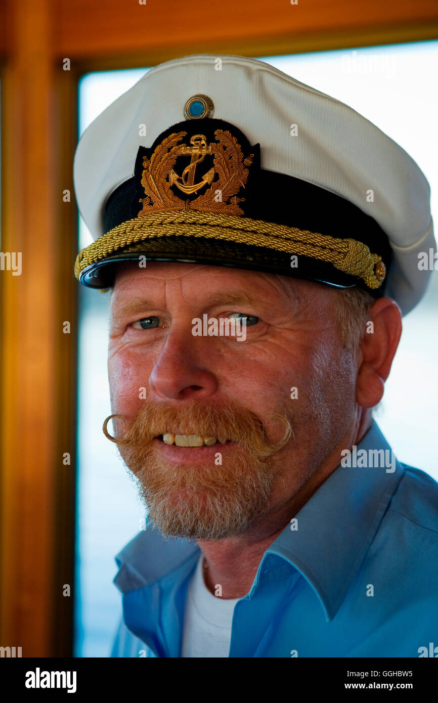 Captain of an excursion boat, Ammersee, Upper Bavaria, Bavaria, Germany ...