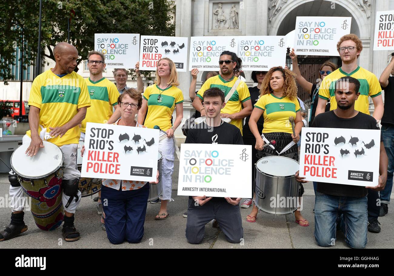 Kate Allen, the UK Director of Amnesty International, (front left ...