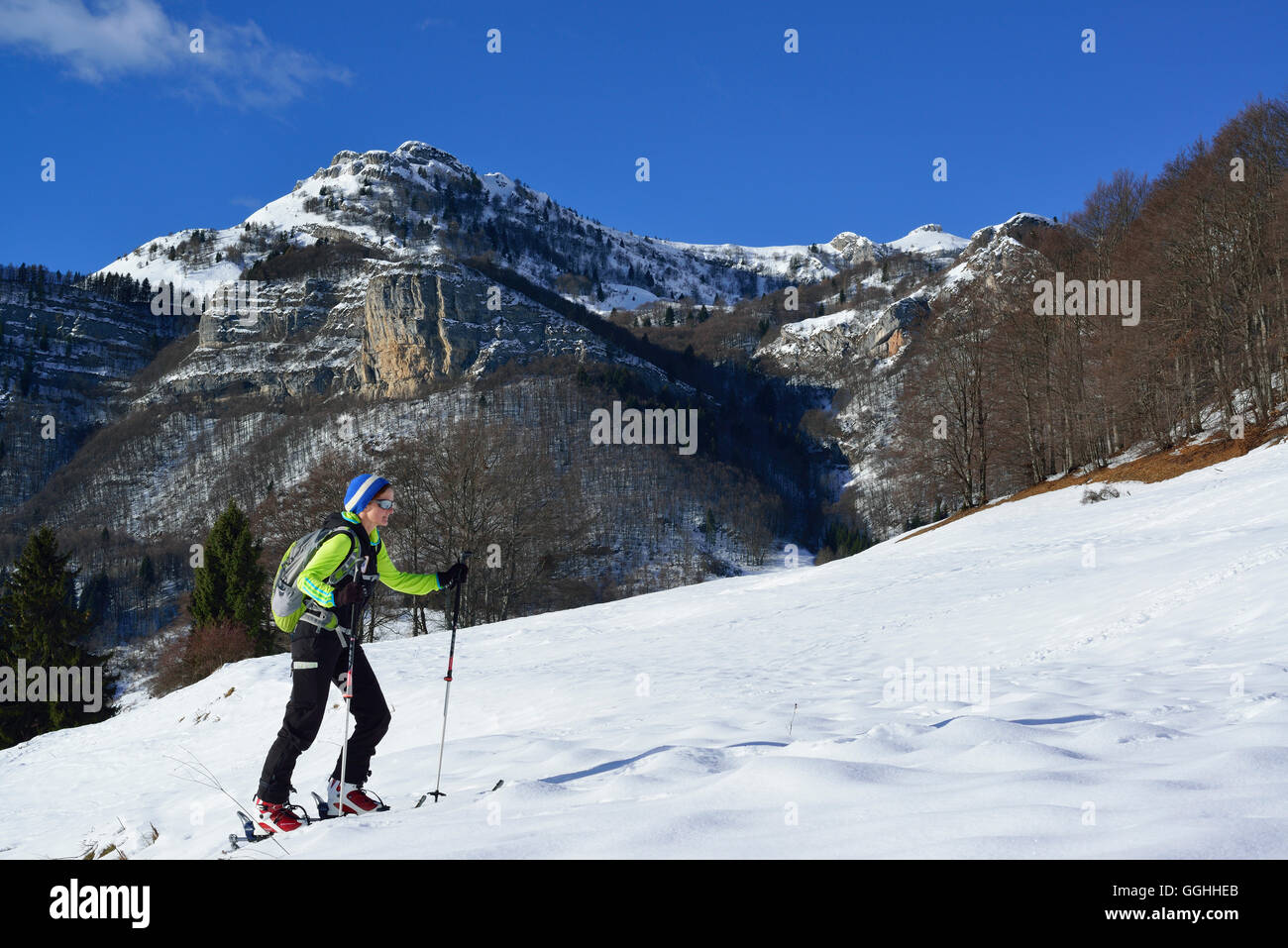 Female back-country skier ascending to Monte Baldo, Garda Mountains ...