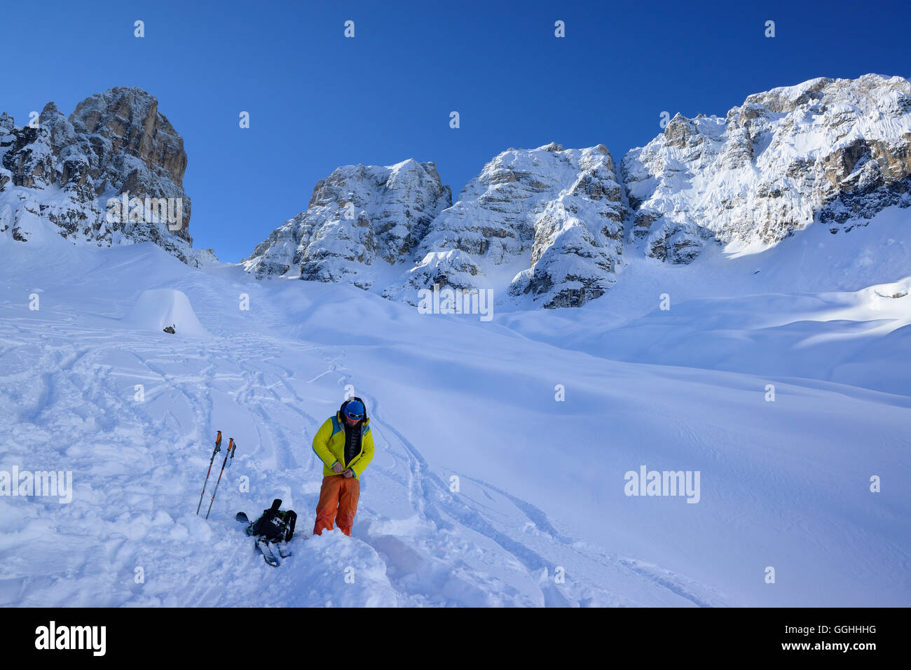 Back-country skier resting, Cristallo wind gap, Cristallo, Dolomites ...