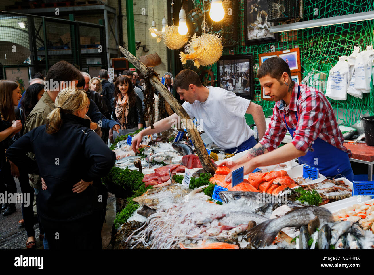 Fishmonger at borrough market hi-res stock photography and images - Alamy