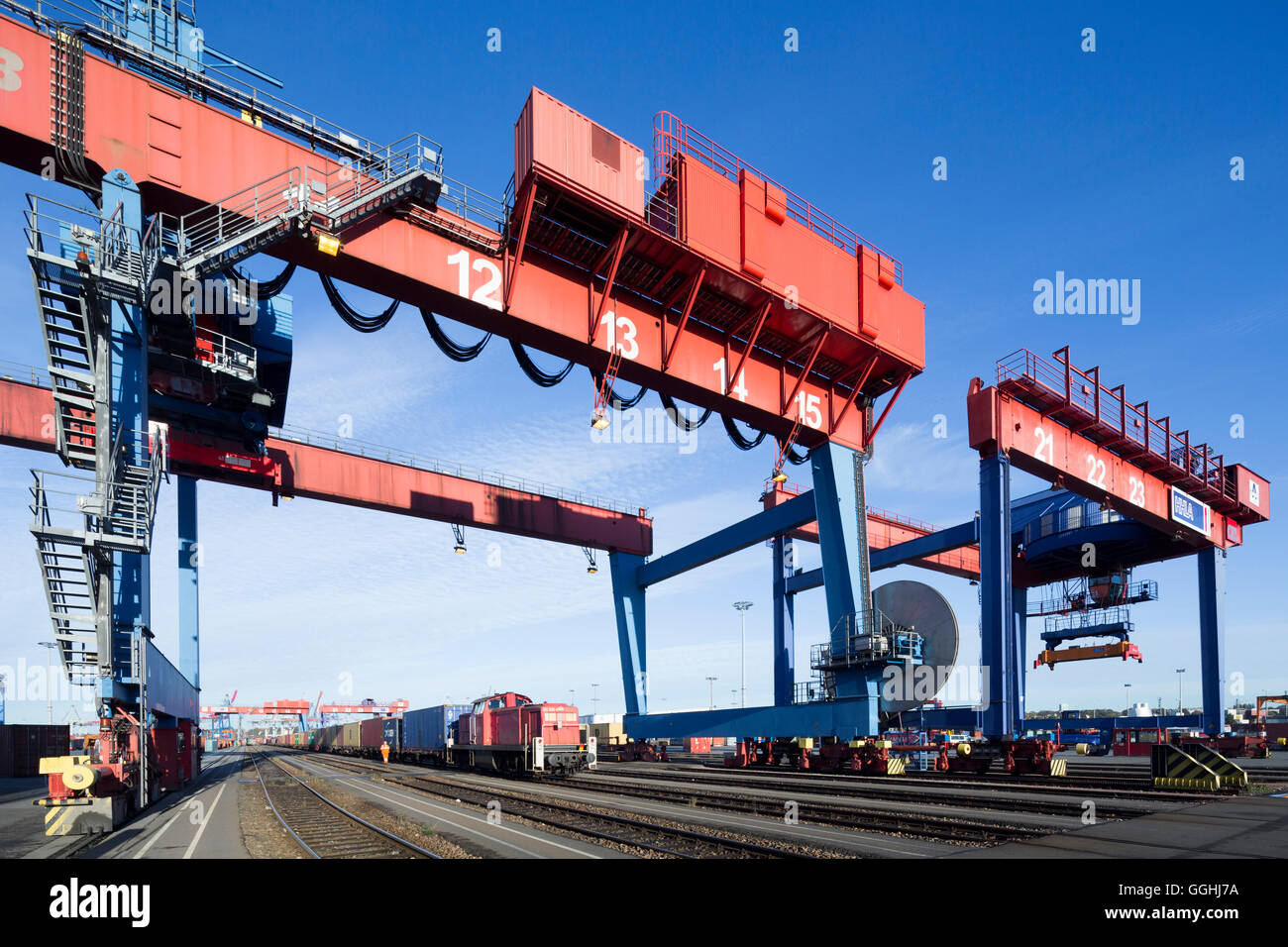Freight train under a container bridge, Hamburg, Germany Stock Photo ...