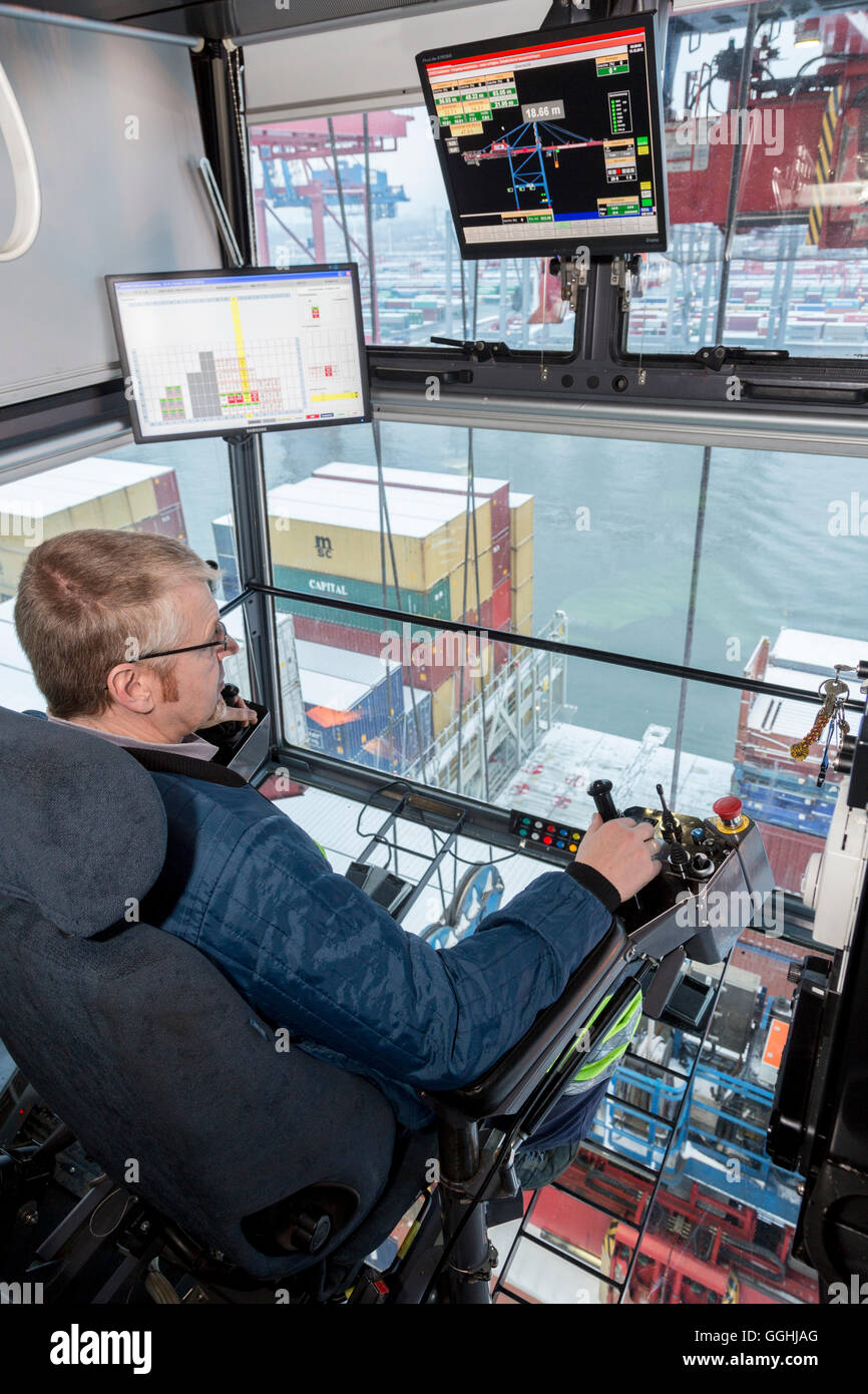 Container gantry crane driver loaded and unloaded a container shipt at ...