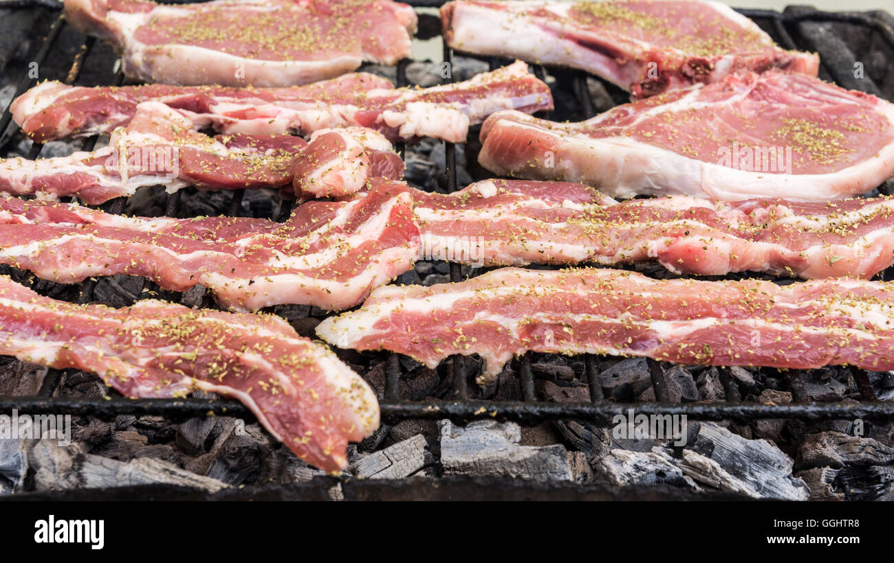 Preparation of grilled meat steak on fire Stock Photo - Alamy