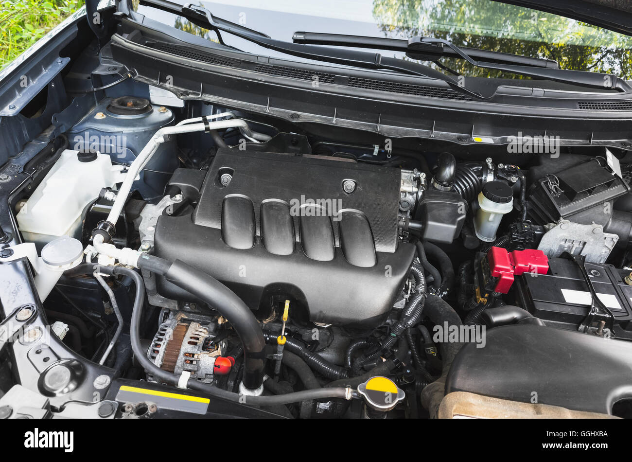 Modern suv car undersquare engine under oped hood Stock Photo - Alamy