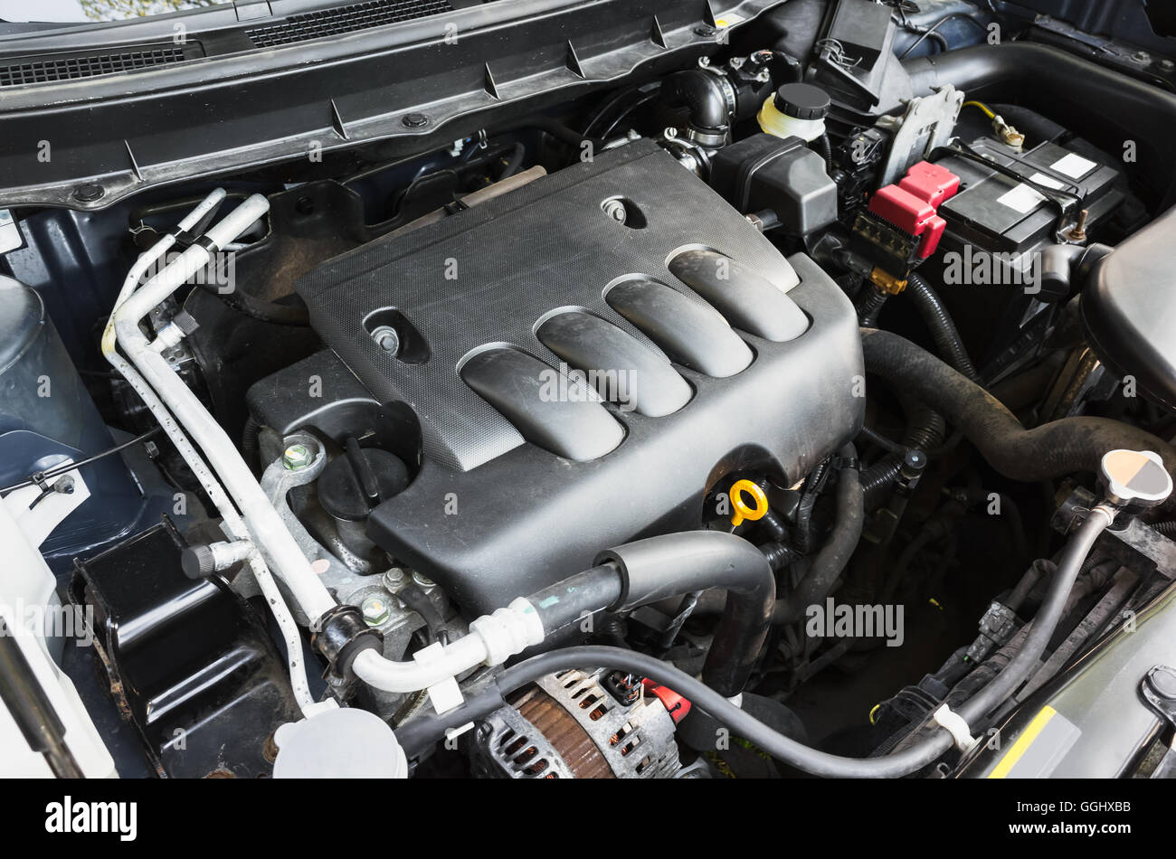 Modern suv car undersquare engine under oped hood Stock Photo - Alamy