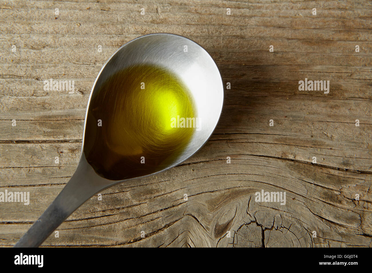 Oil wooden spoon table hi-res stock photography and images - Alamy