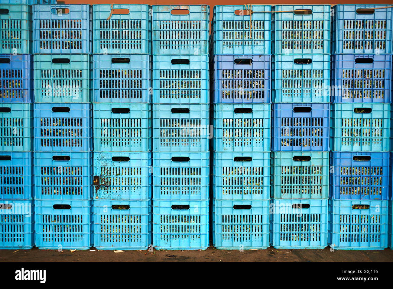 many colored blue plastic crate with olives Stock Photo - Alamy