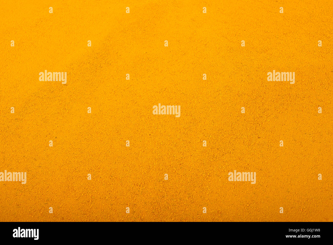turmeric powder background Stock Photo - Alamy