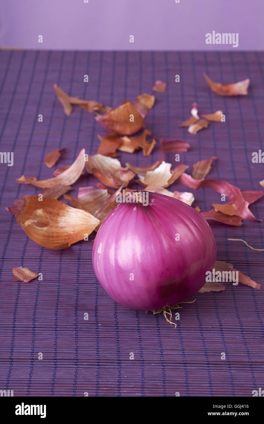 purple onions on purple background Stock Photo - Alamy