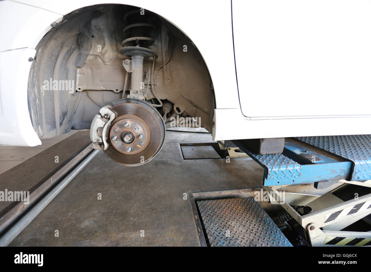 Wheel hub of a car in repair of the damage,Garage shop Stock Photo - Alamy