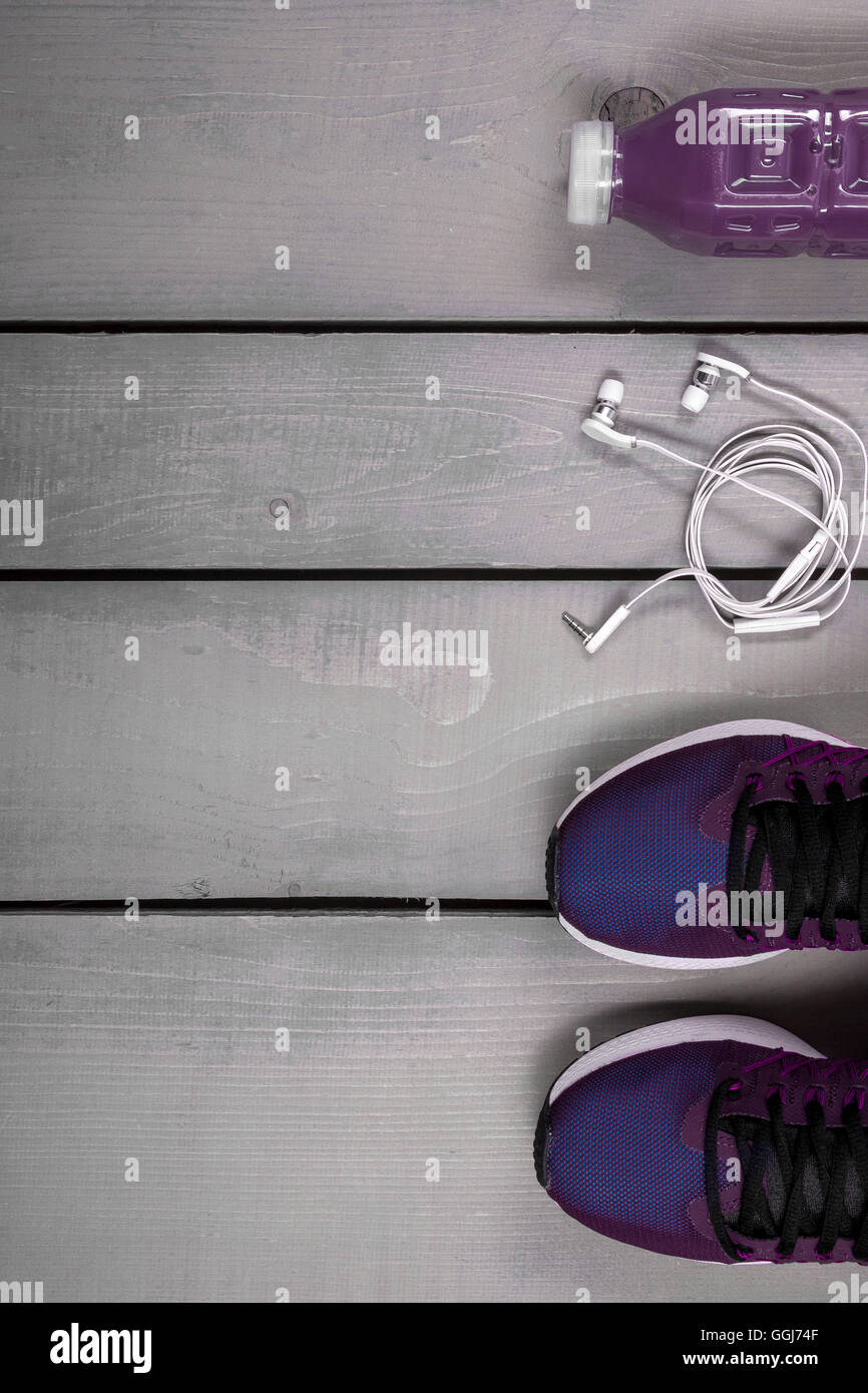 Overhead view woman's workout outfit. Female sports equipment. Purple ...