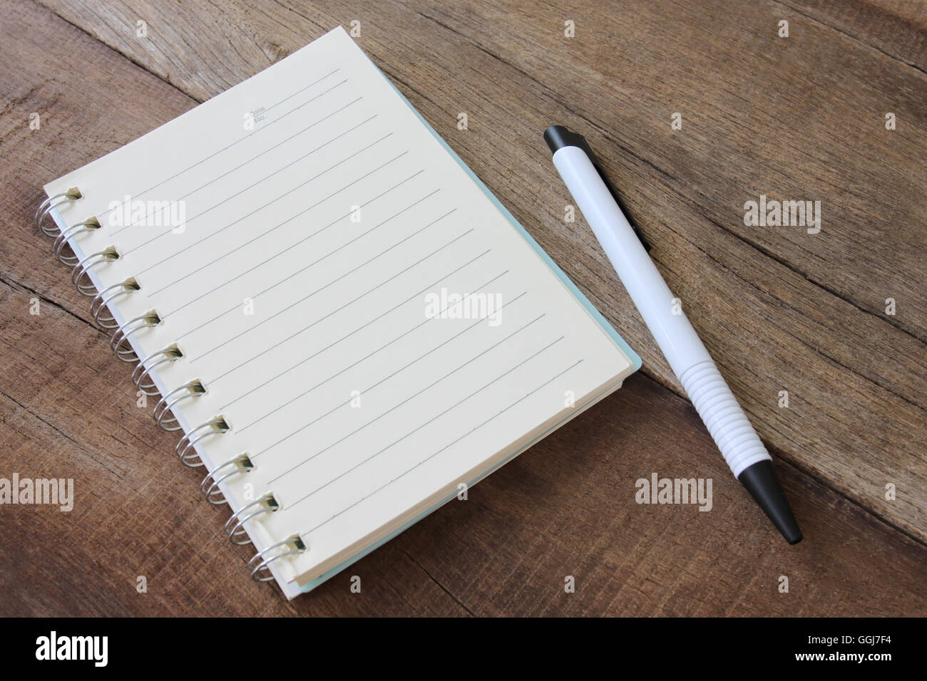Blank notebook and pen color on wooden floor for design background ...