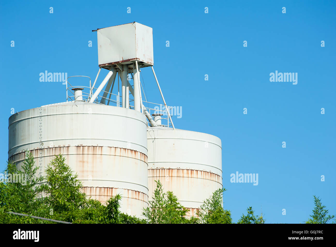 White silos for the storage of lime and cement Stock Photo - Alamy