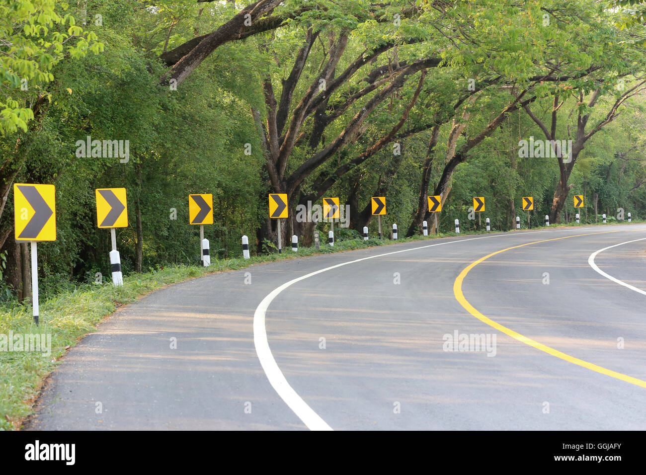 The road curve with street signs reflex light,At night you can see the ...