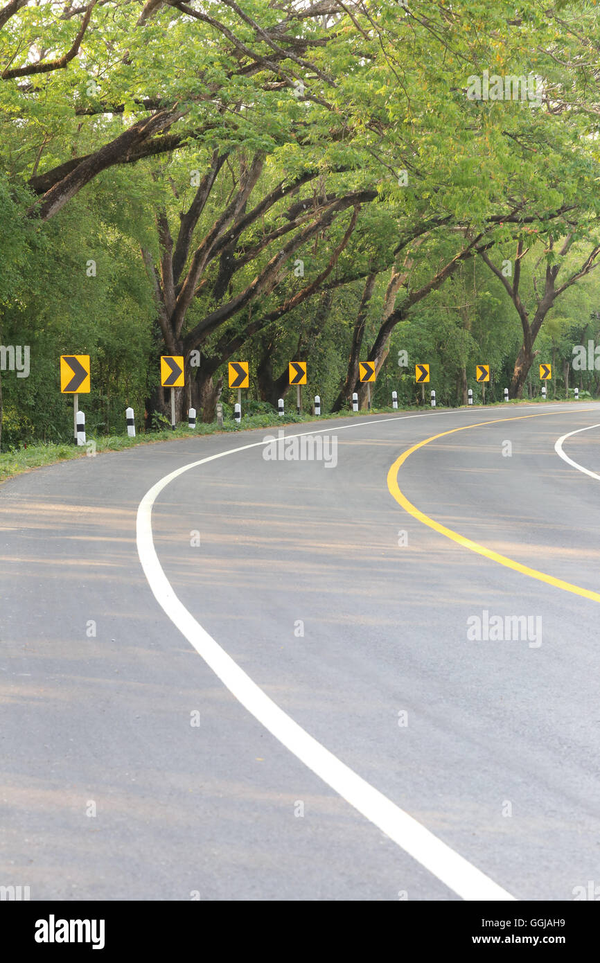 The road curve with street signs reflex light,At night you can see the ...