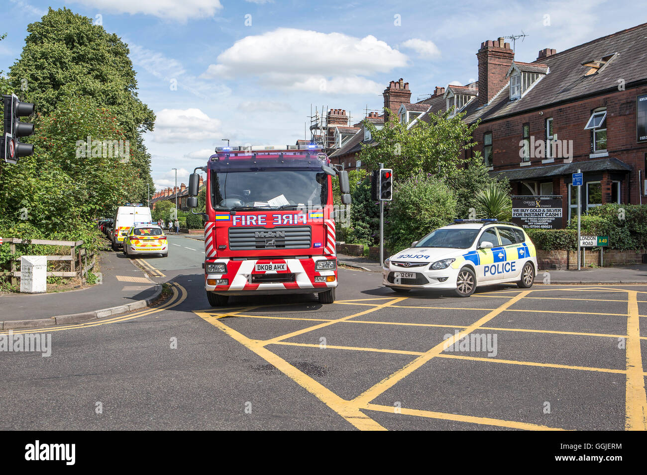 Police car and fire engine block a road in Stockton Heath, Cheshire, Uk ...