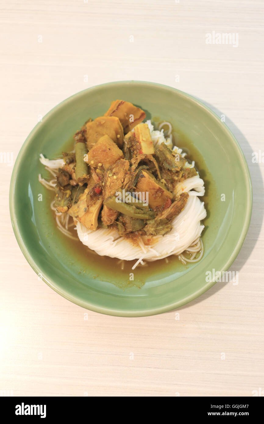 Curry fish kidney noodles (KHANOM CHIN) with vegetable of Thai foods ...