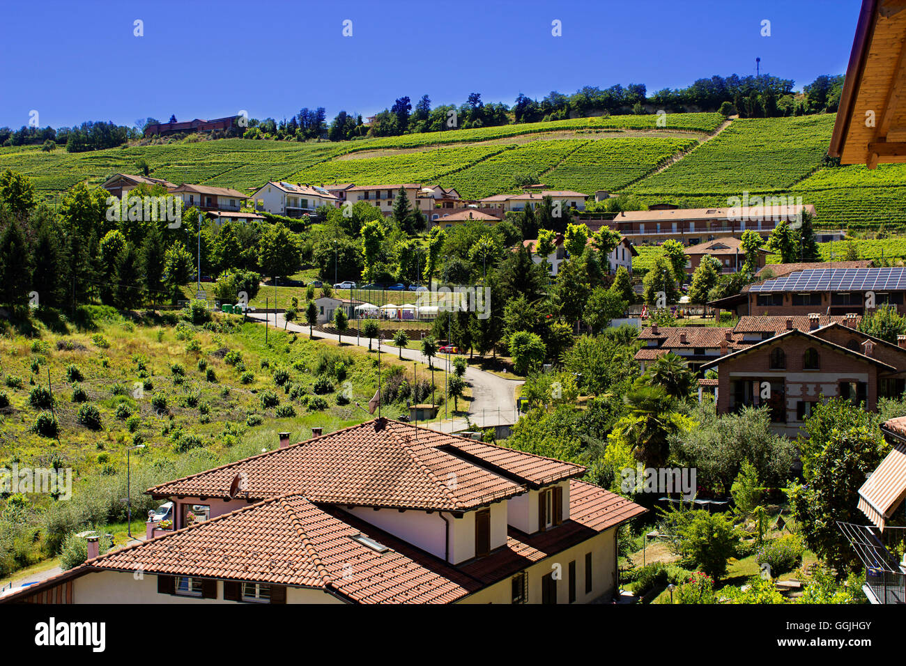 Landscape view of the well-known town of Barolo among green hills and ...