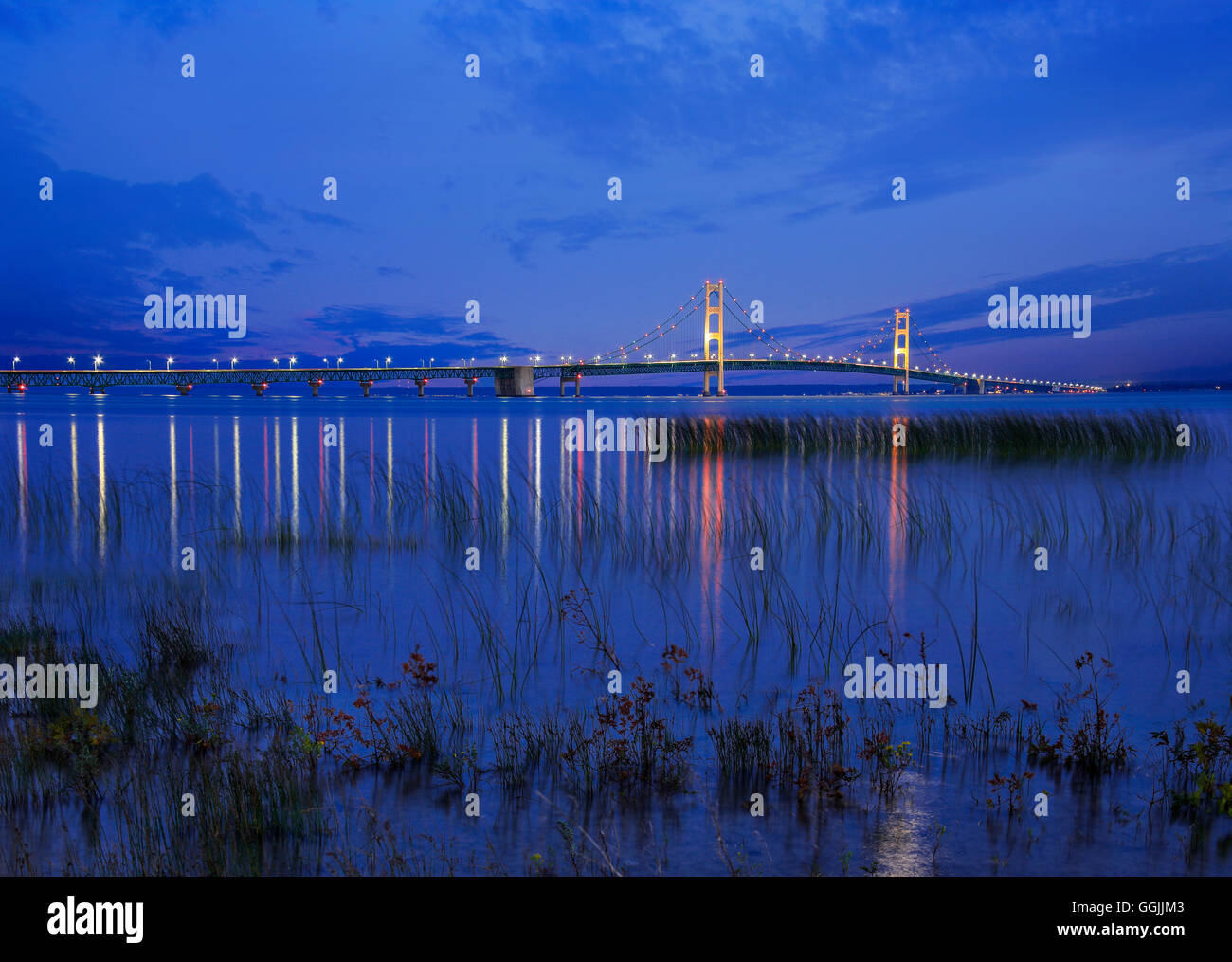 Seen From St Ignace in the upper peninsula at dusk, the Mackinac Bridge ...