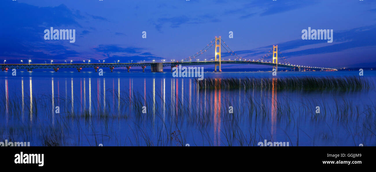 Seen From St Ignace in the upper peninsula at dusk, the Mackinac Bridge ...