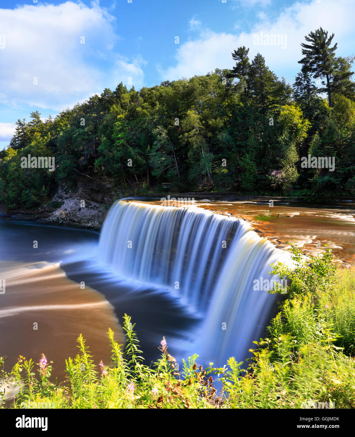 A very picturesque waterfall with silky motion blur, Tahquamenon Falls ...