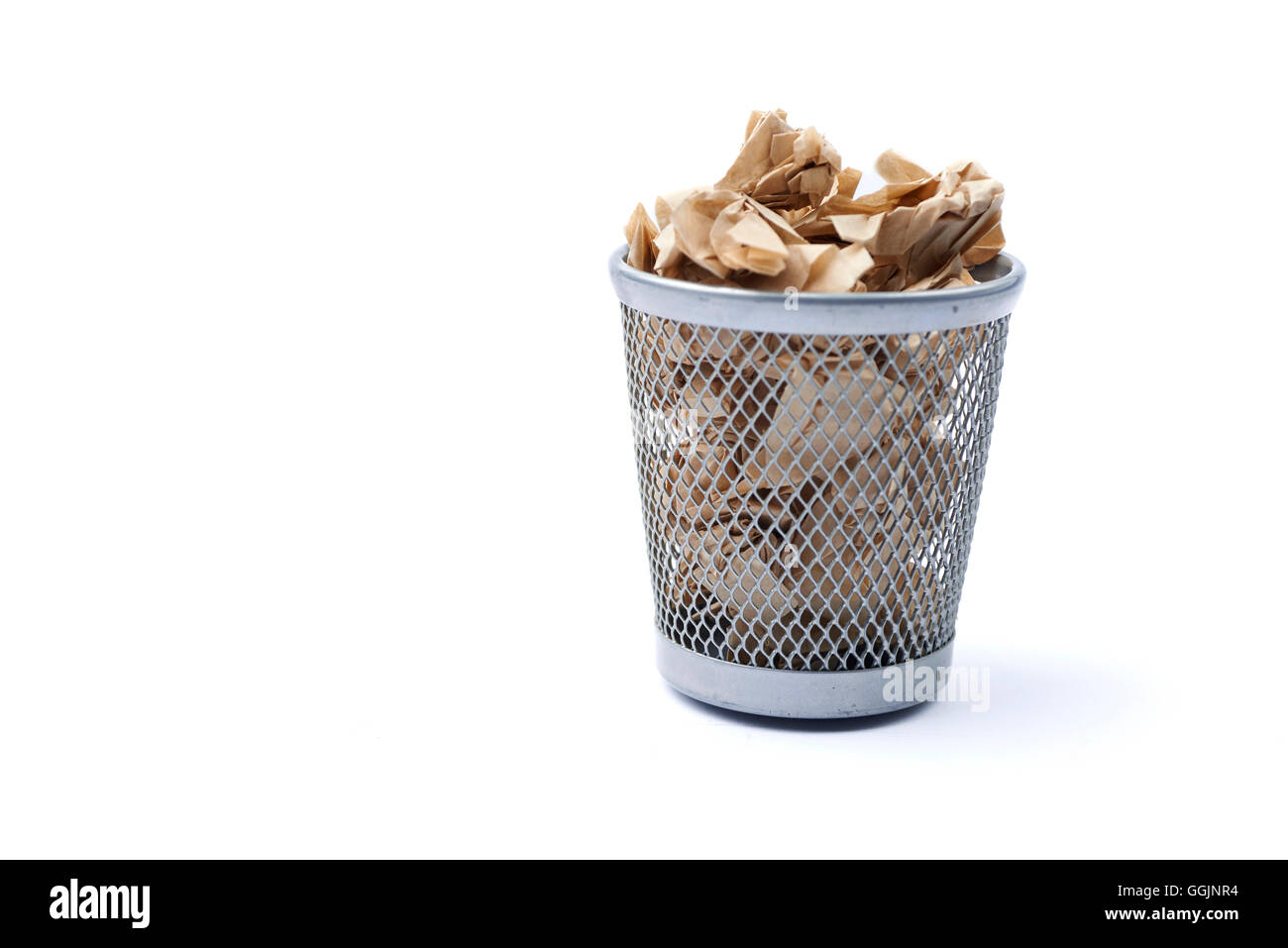 Iron trash bin full of paper isolated on white background Stock Photo ...