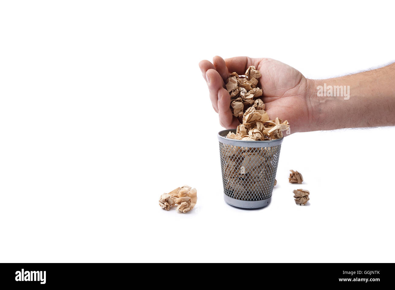 man's hand put paper in iron trash bin isolated on white background ...