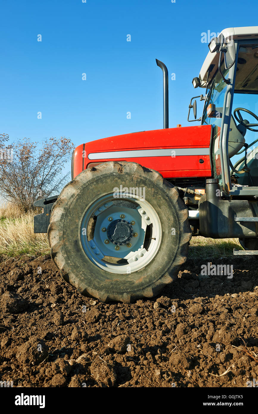 agricultural tractor sowing seeds and cultivating field Stock Photo - Alamy