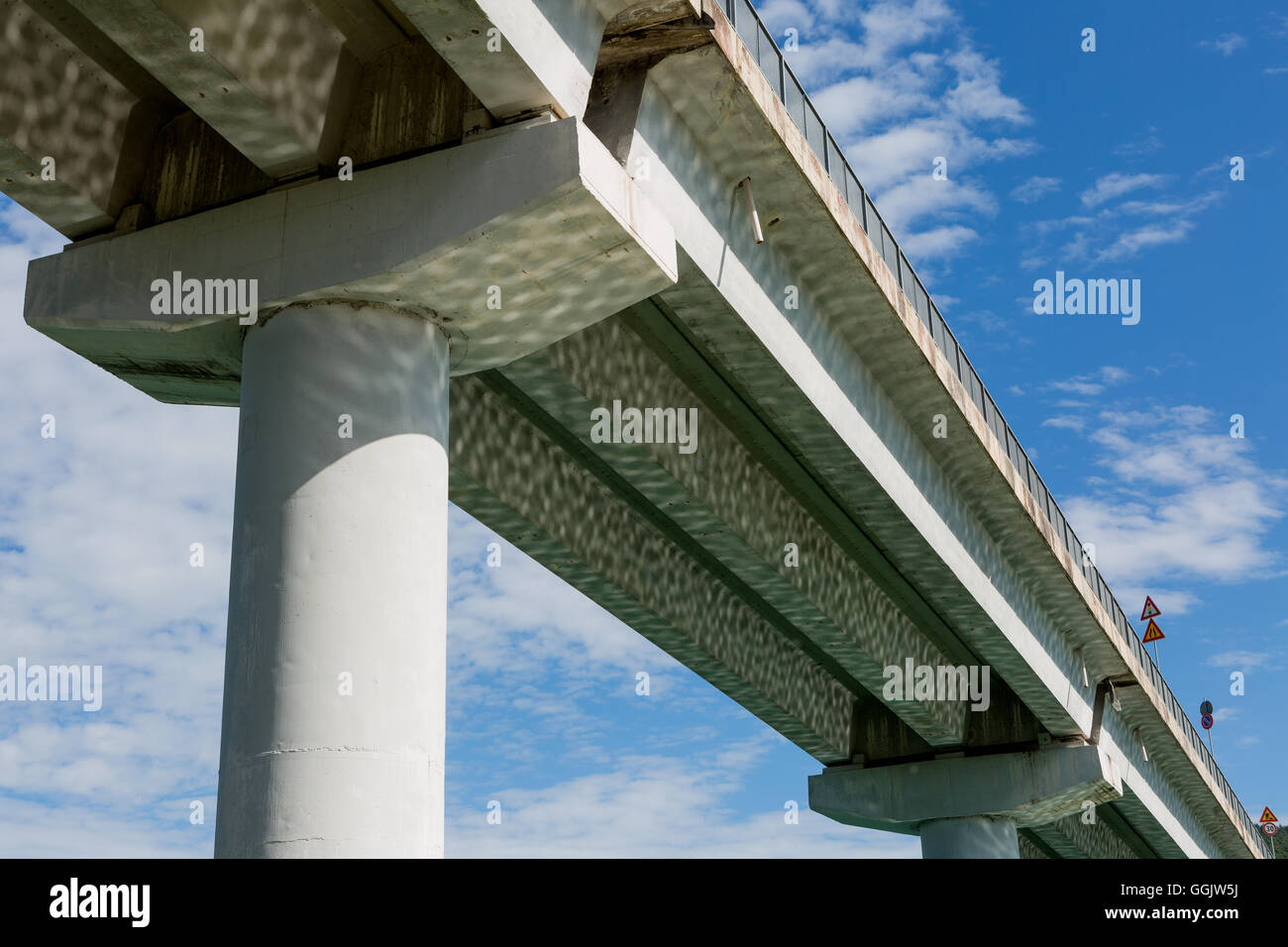 Low angle view of the flyover above the lake of Cingoli against blue ...