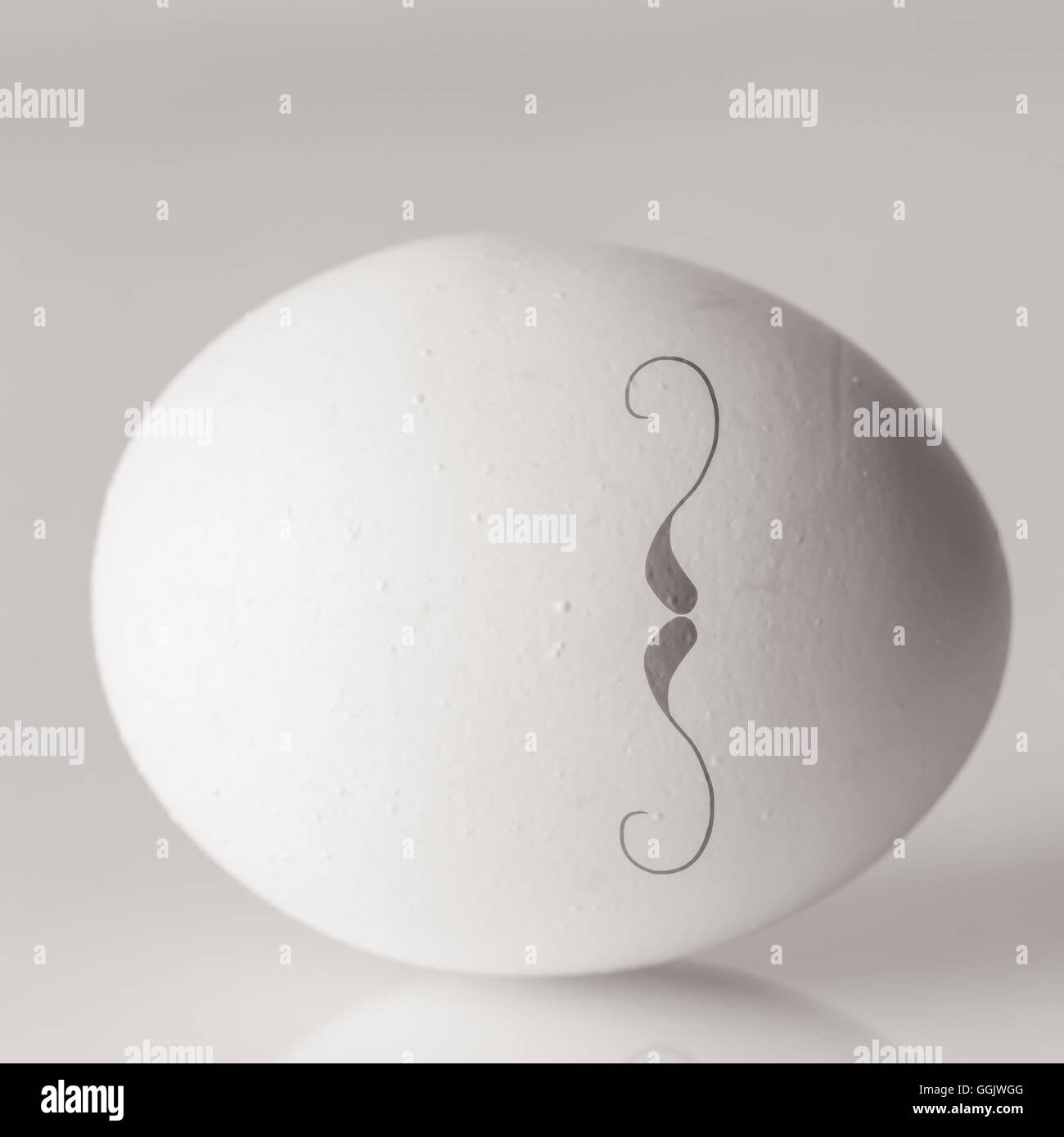 White egg on side with directional light and painted mustache Stock ...