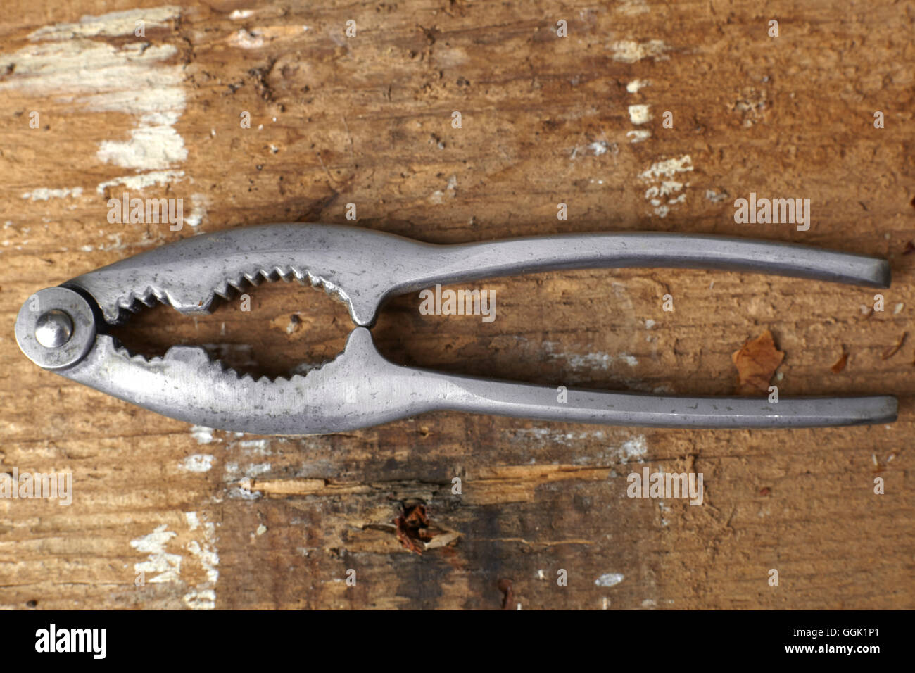 close up of vintage nut cracker on wooden table Stock Photo - Alamy