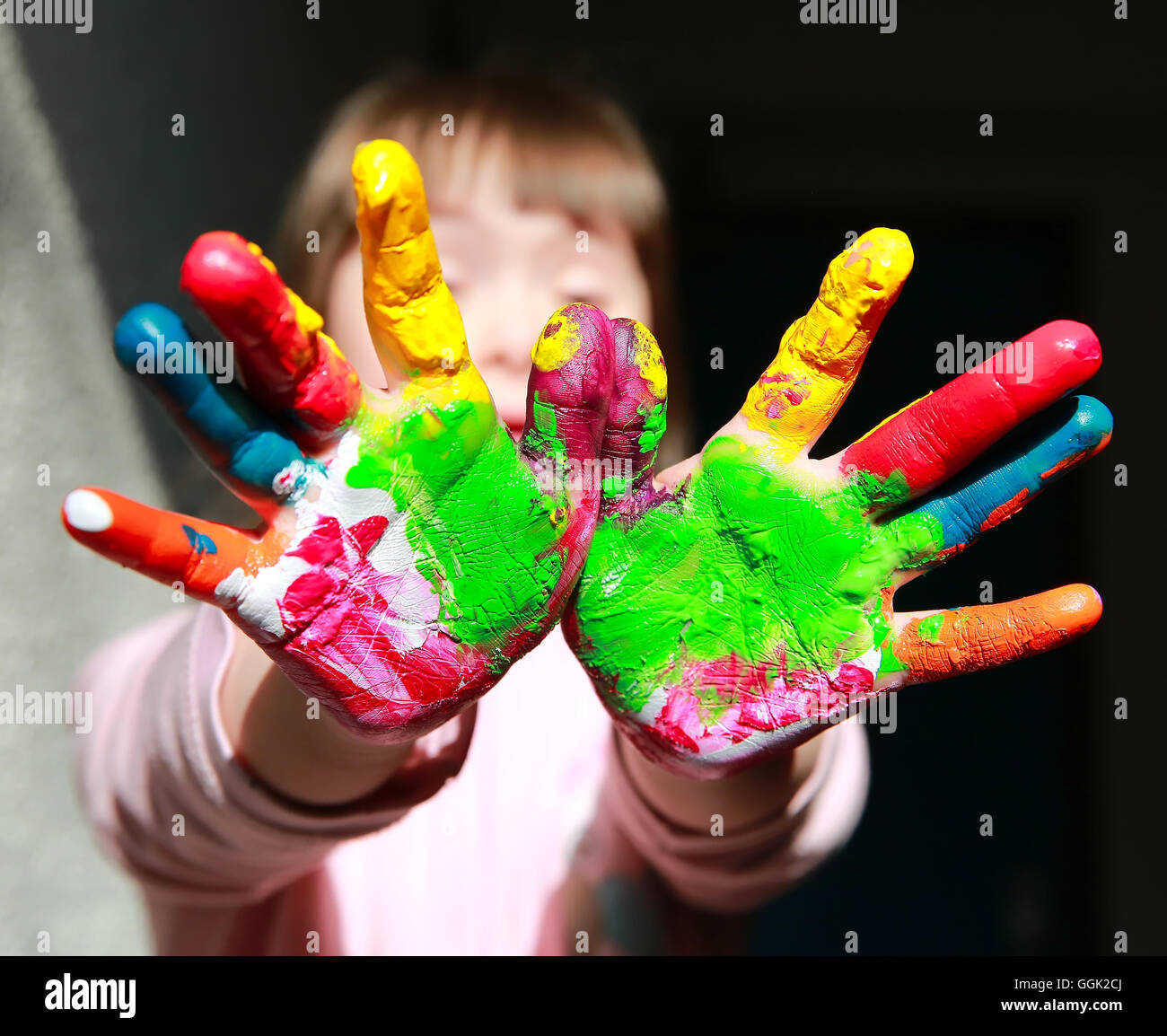 Cute little kid with painted hands Stock Photo - Alamy