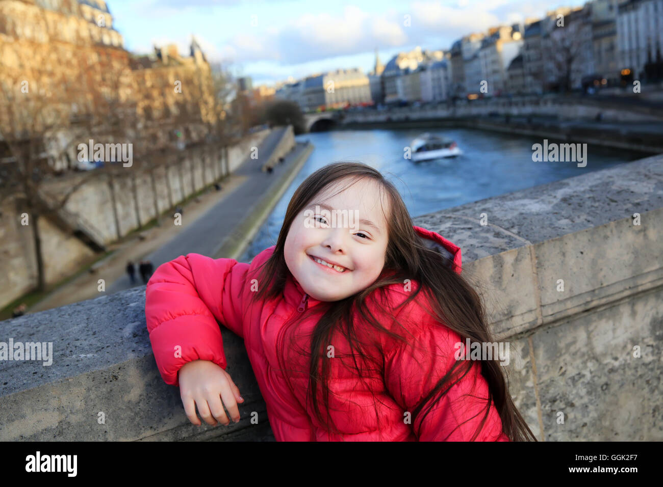 Portrait of little girl smiling in Paris Stock Photo - Alamy