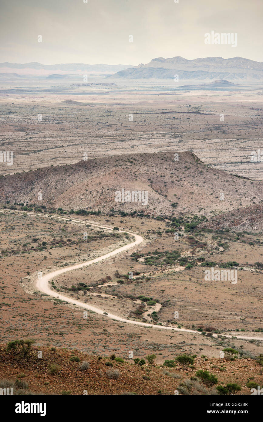 Curvy dirt track road along the outback highlands, Namibia near Windhuk ...