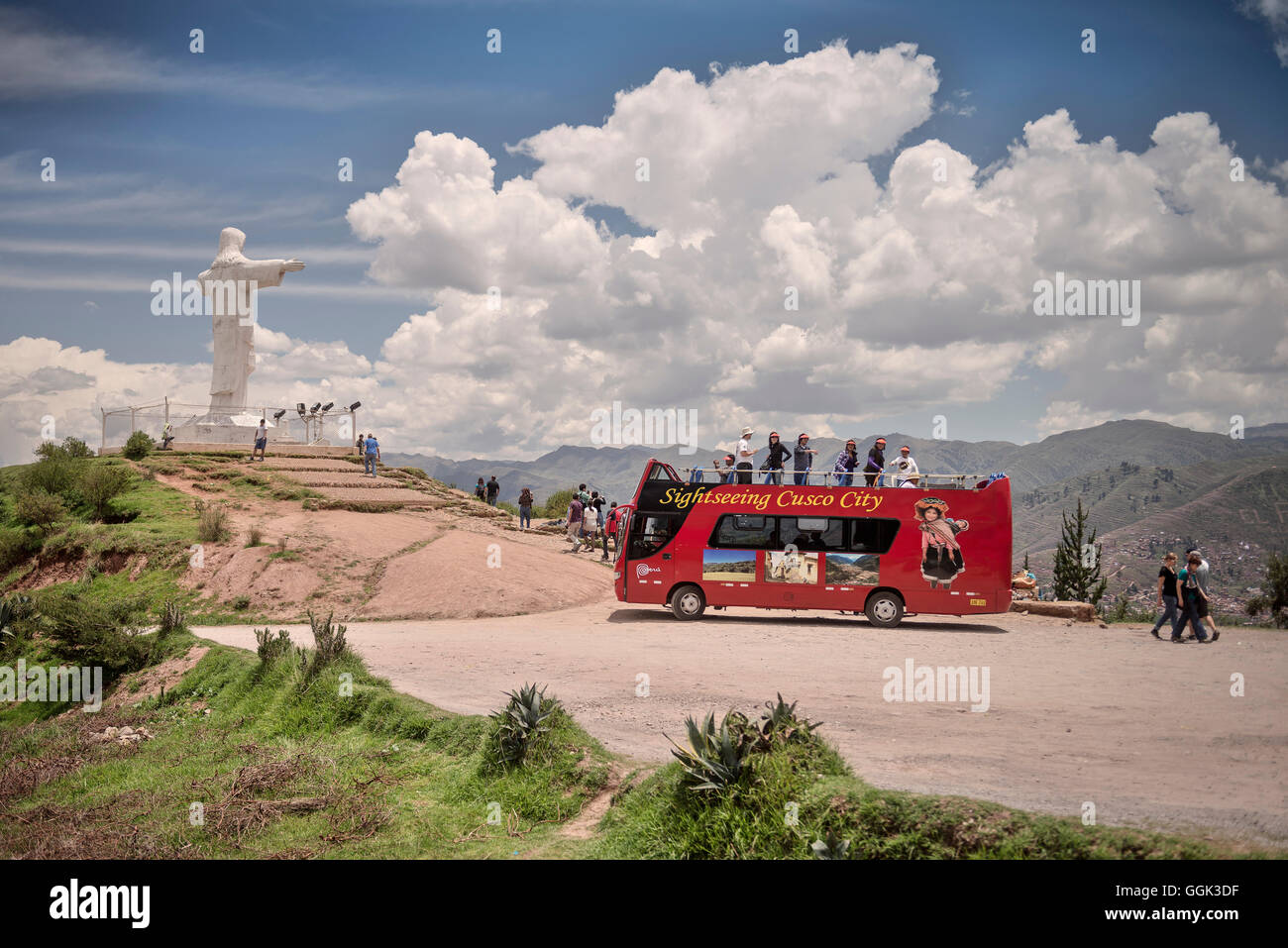 Red Tourist Bus stopping at the viewing platform of the white Christ ...