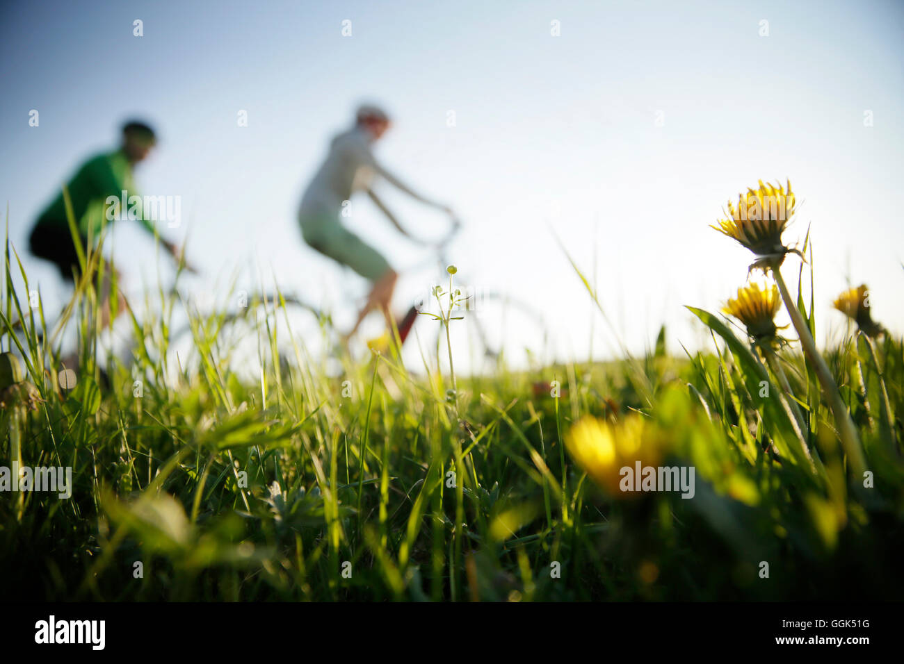 Two cyclists riding e-bikes, Munsing, Upper Bavaria, Germany Stock ...