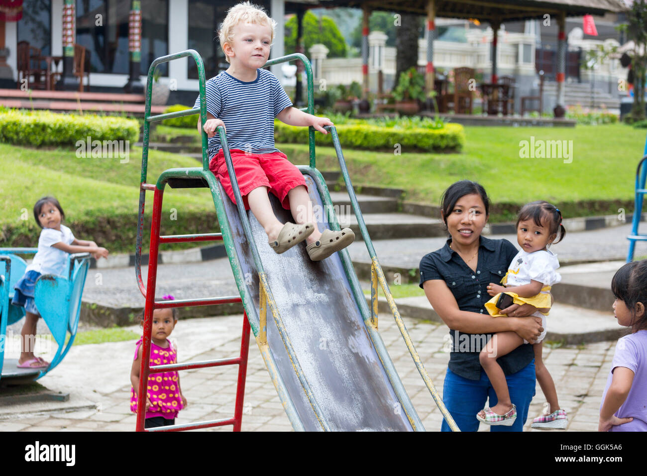 Kids playing on slide hi-res stock photography and images - Alamy